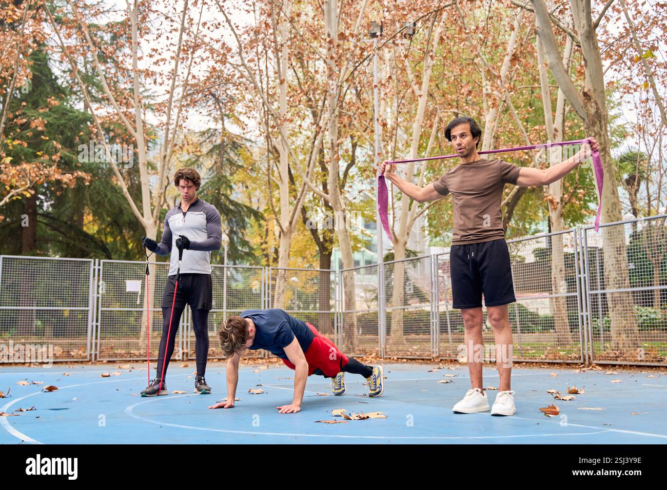 Three male athletes performing hi-res stock photography and images - Alamy