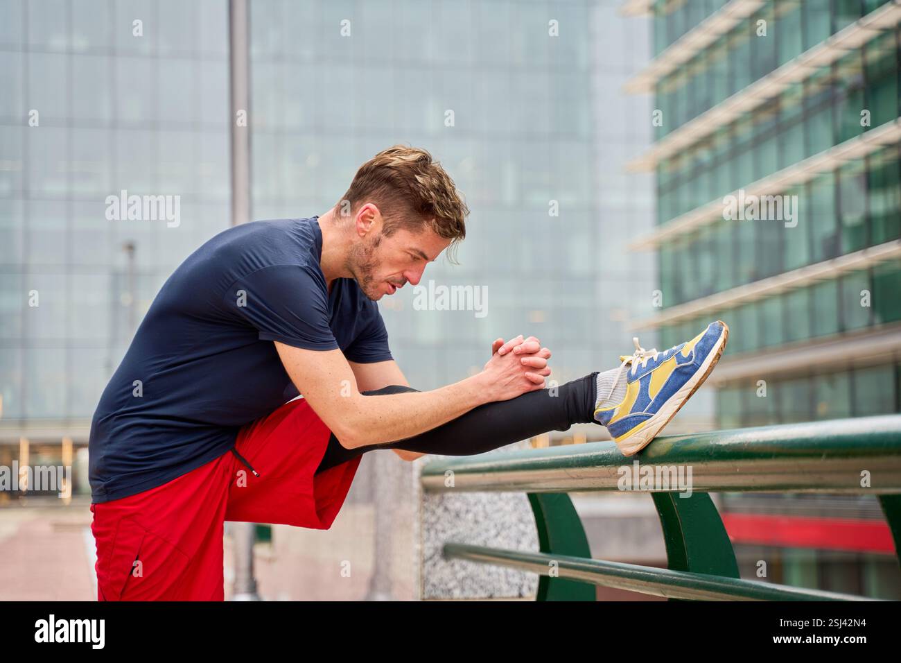 Concentrating on stretching legs hi-res stock photography and images ...