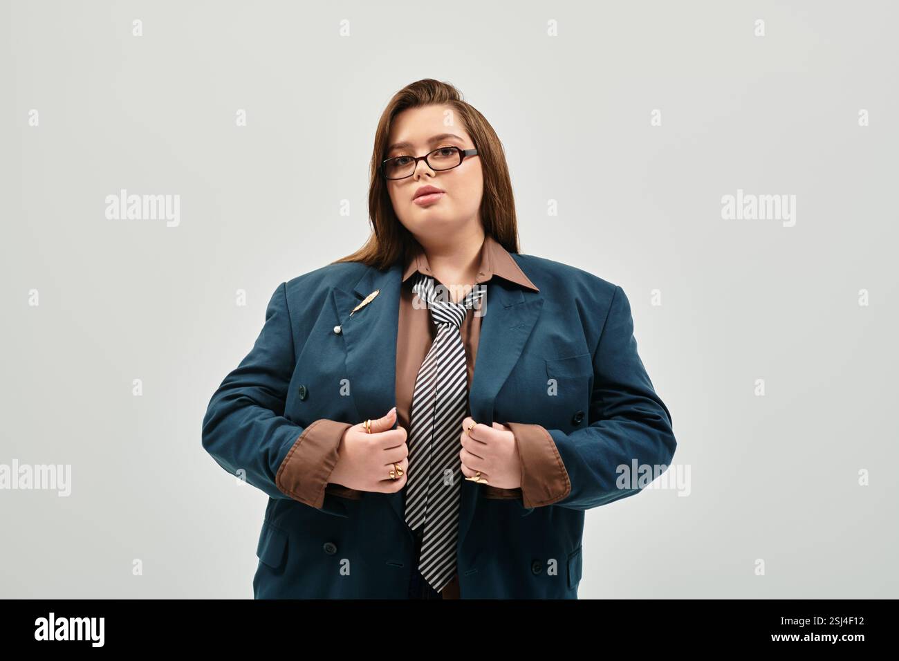 A beautiful plus size woman confidently showcases her oversized suit ...