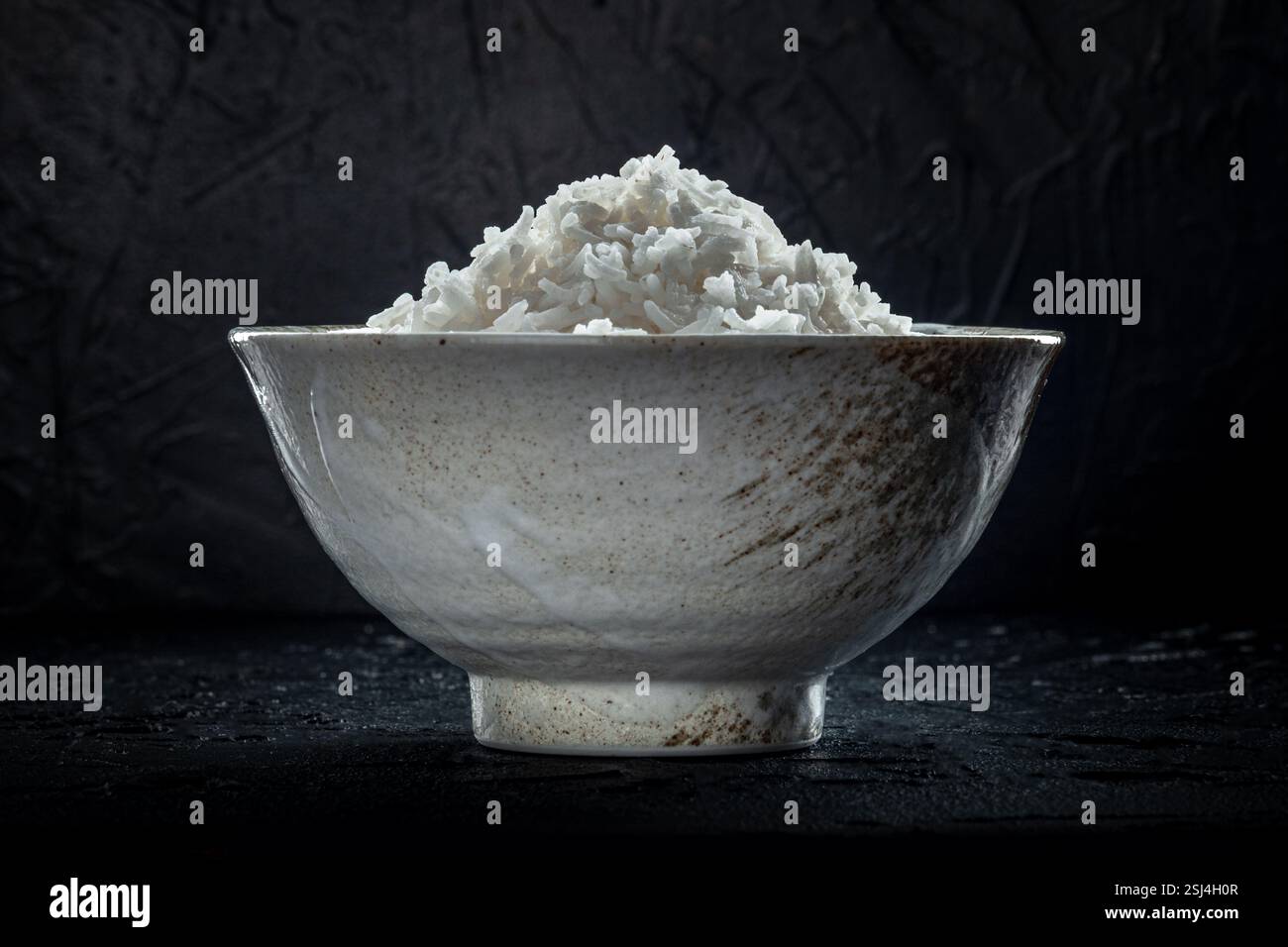 White rice, cooked. A bowl of boiled long grain rice, a simple side ...