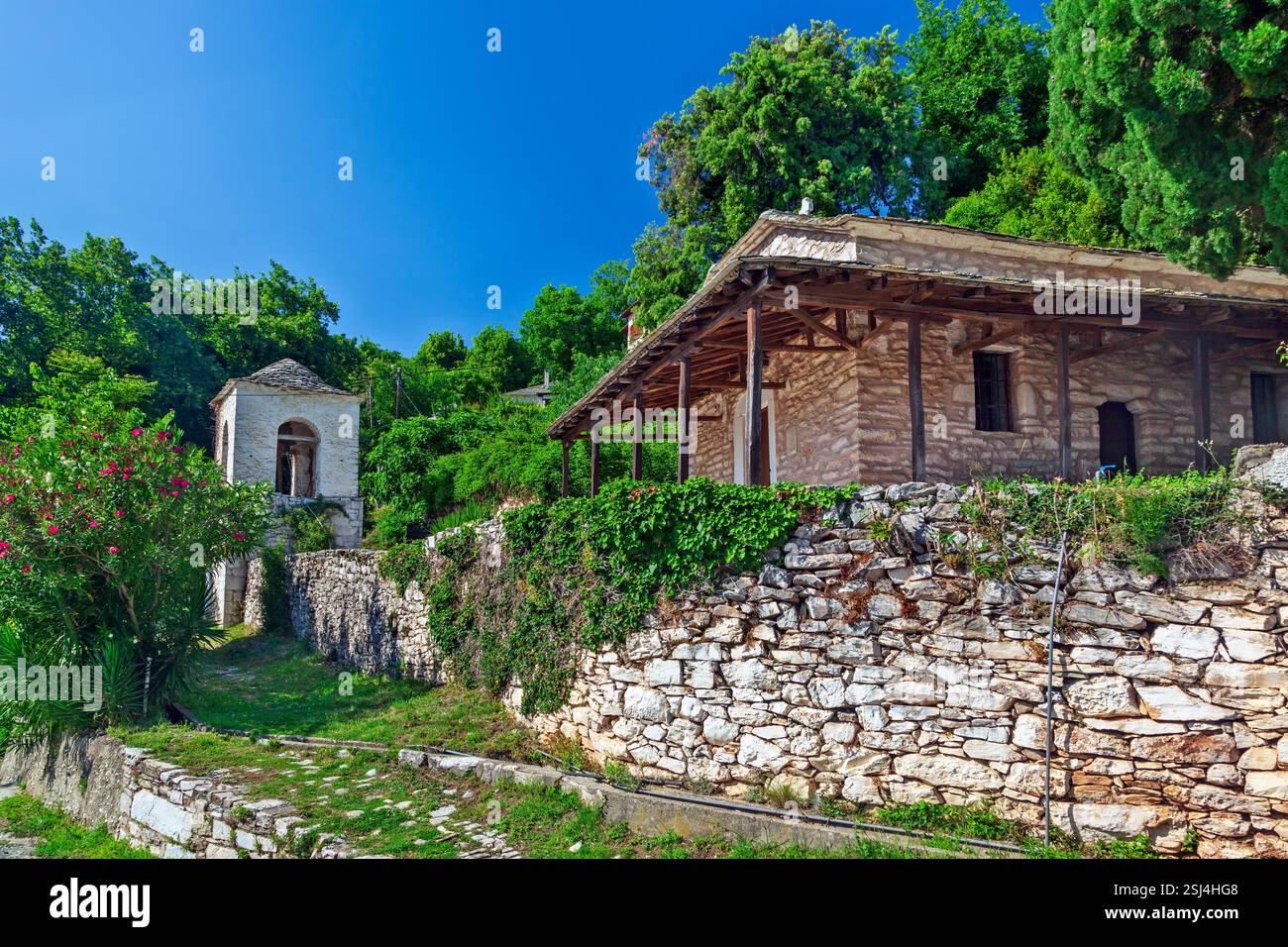 Traditional architecture and lush greenery in Milies village, a ...
