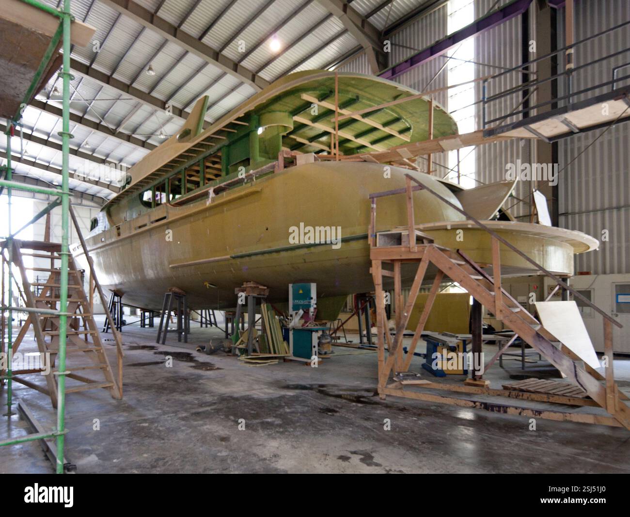 Shipbuilding Industry. Glass fiber hull of a yacht being build at the ...