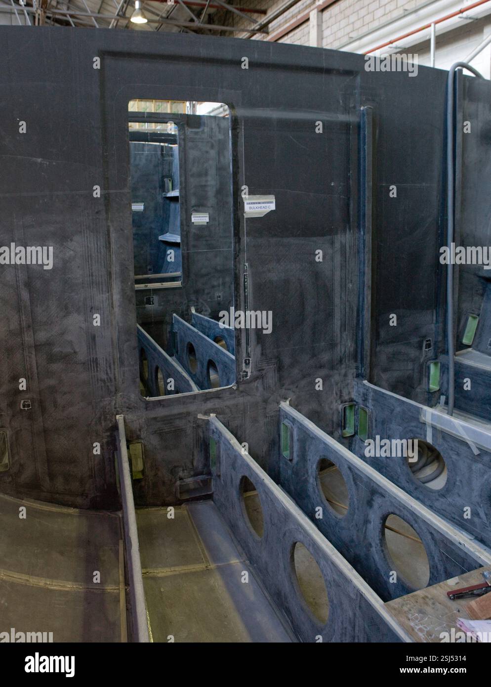 Shipbuilding Industry. Working on glass fiber hull of super sailing ...