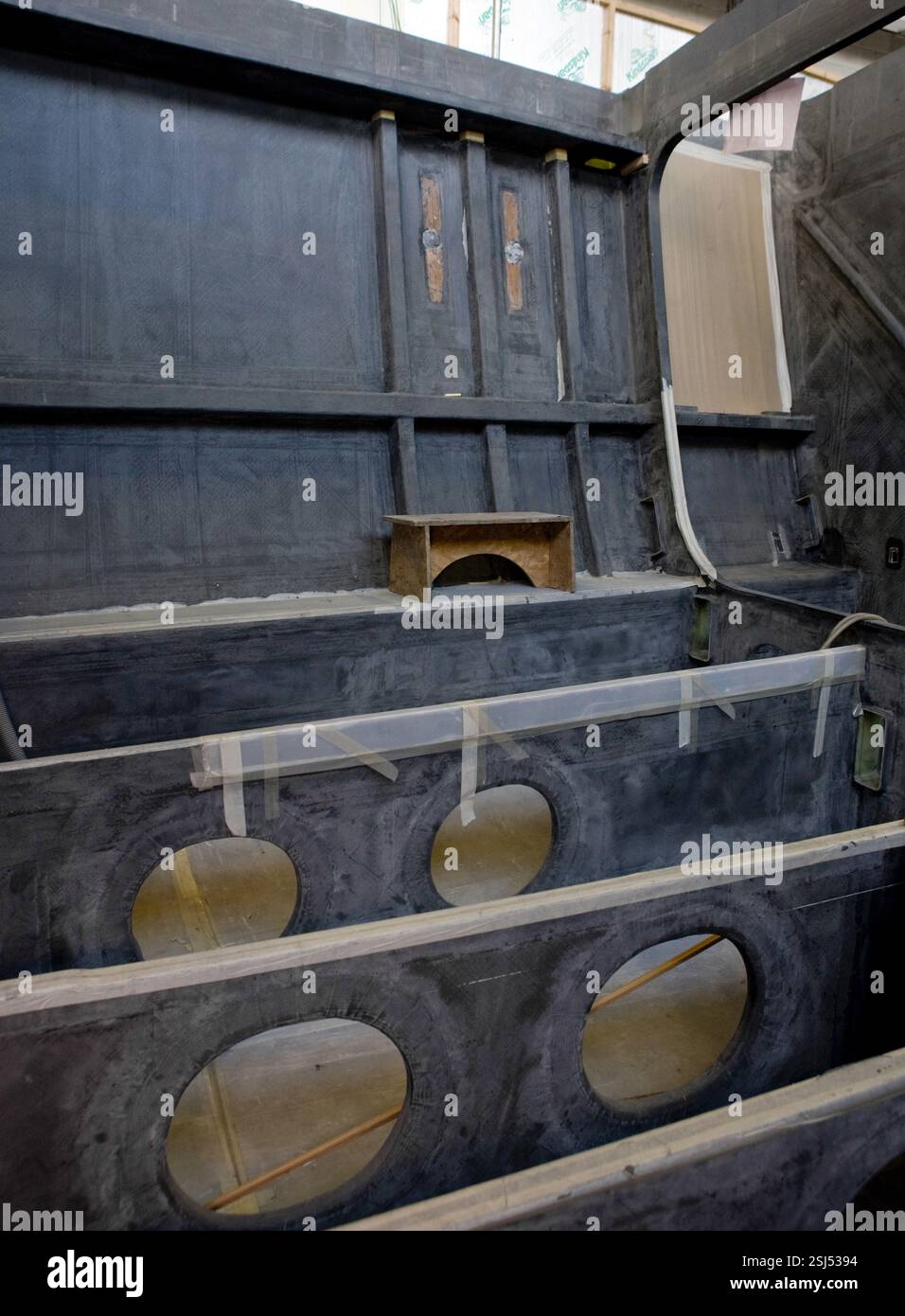 Shipbuilding Industry. Working on glass fiber hull of super sailing ...