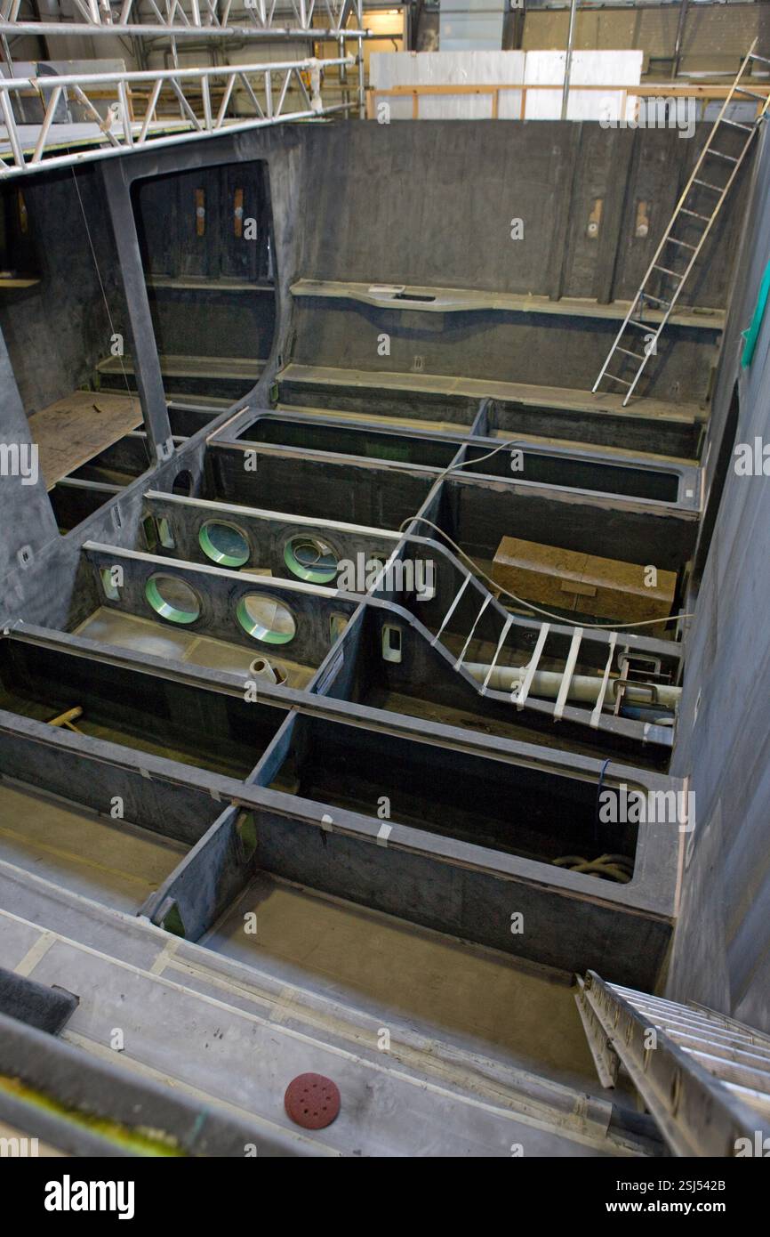 Shipbuilding Industry. Working on glass fiber hull of super sailing ...