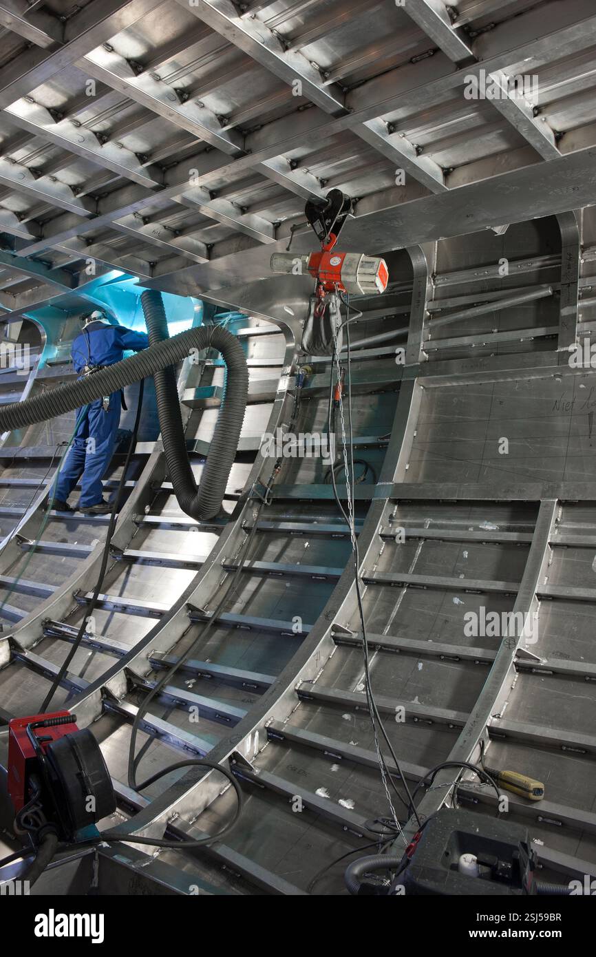 Welder at work welding aluminium. Shipbuilding Industry. Aluminium hull ...