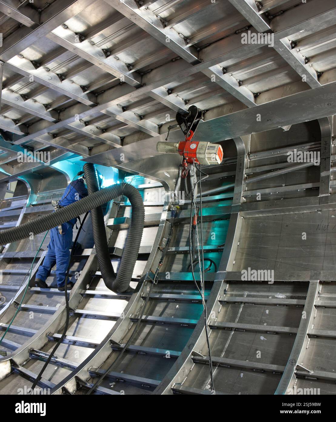 Welder at work welding aluminium. Shipbuilding Industry. Aluminium hull ...