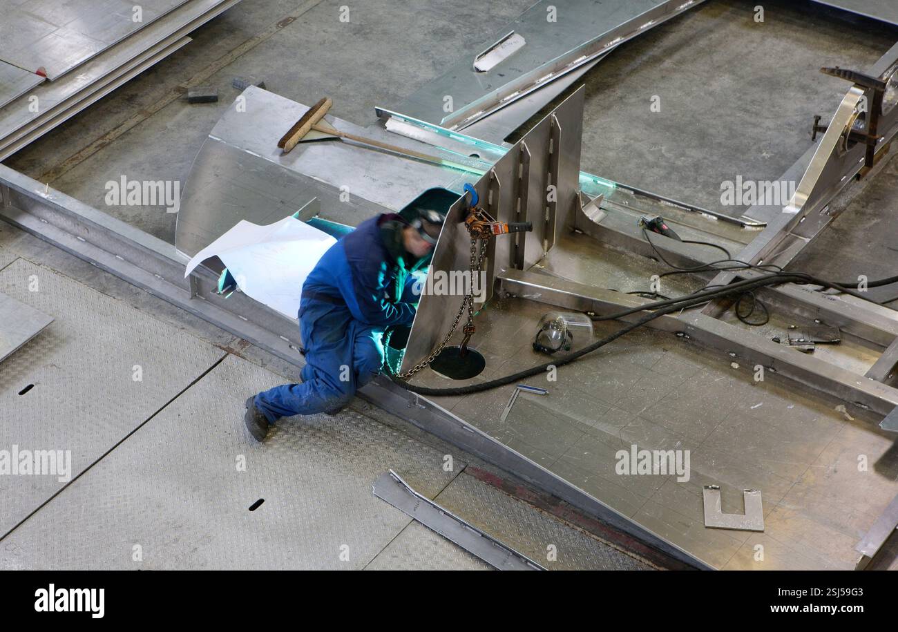 Welder at work welding aluminium. Shipbuilding Industry. Aluminium hull ...