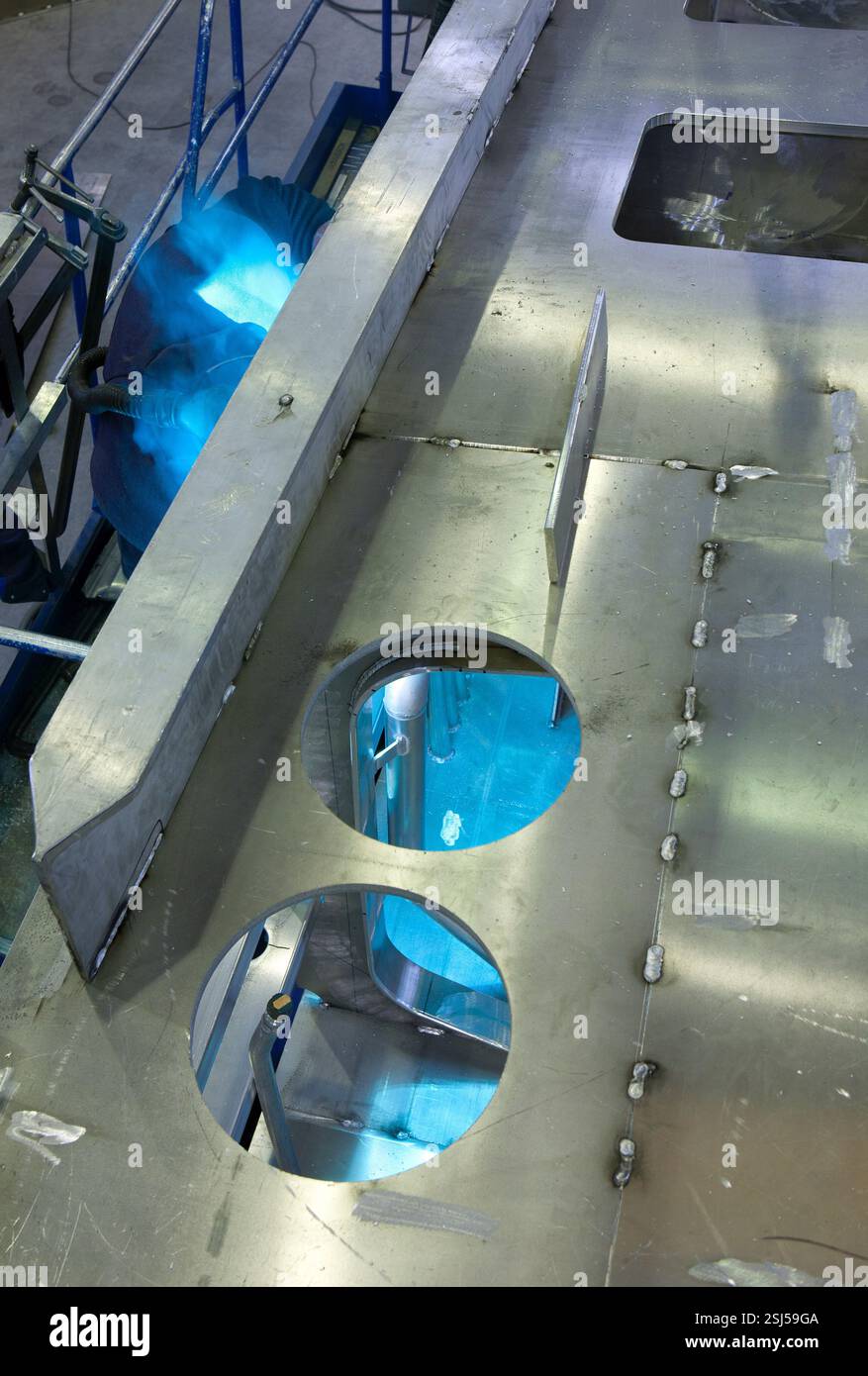Welder at work welding aluminium. Shipbuilding Industry. Aluminium hull ...
