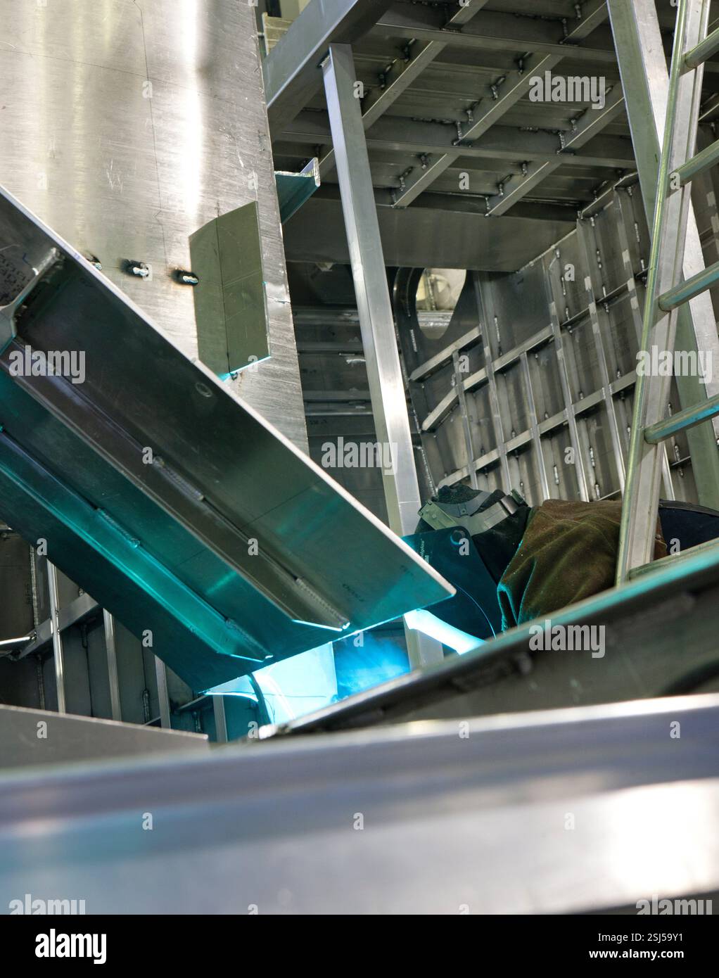 Welder at work welding aluminium. Shipbuilding Industry. Aluminium hull ...