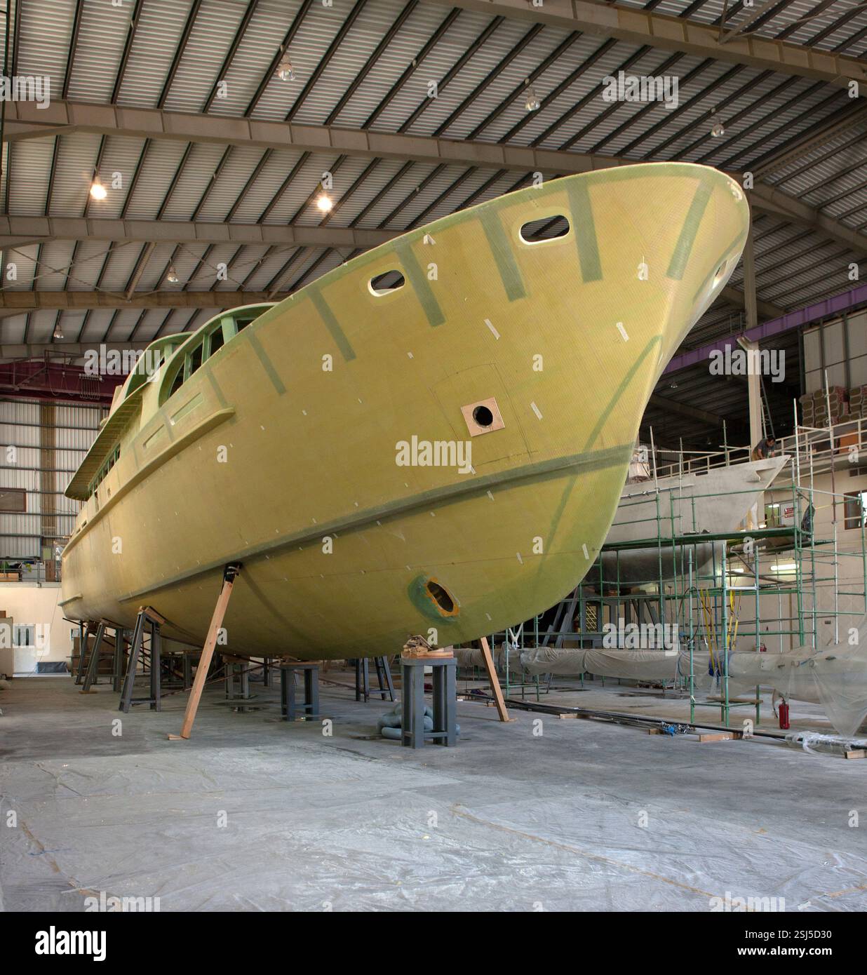 Shipbuilding Industry. Glass fiber hull of a yacht being build at the ...