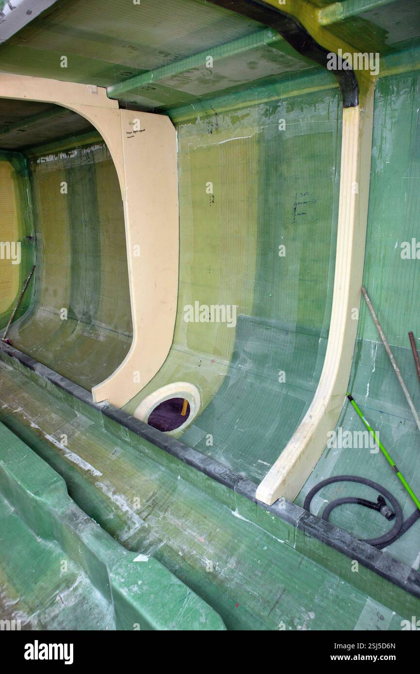 Shipbuilding Industry. Glass fiber hull of a yacht being build at the ...