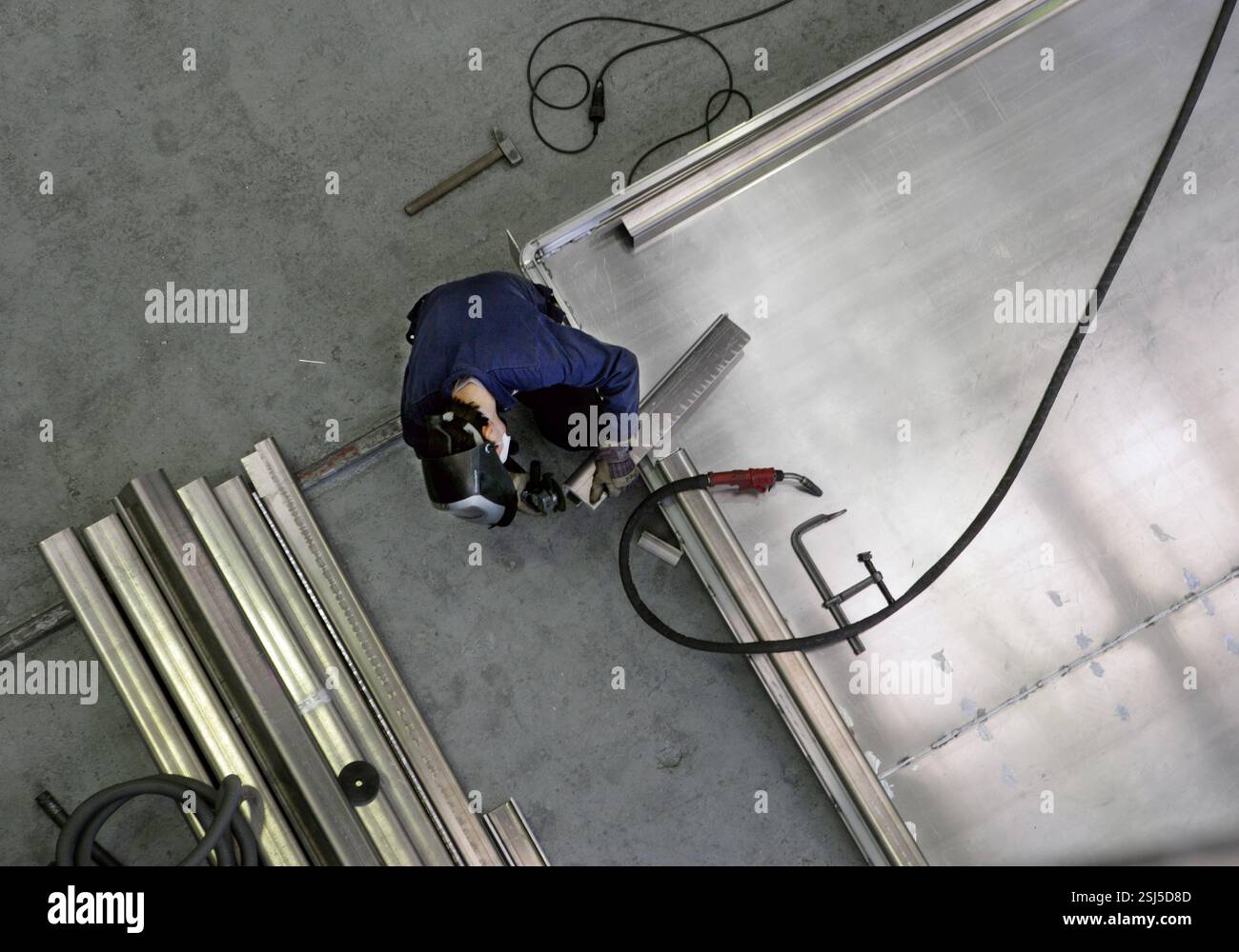 Welder at work welding aluminium. Shipbuilding Industry. Aluminium hull ...