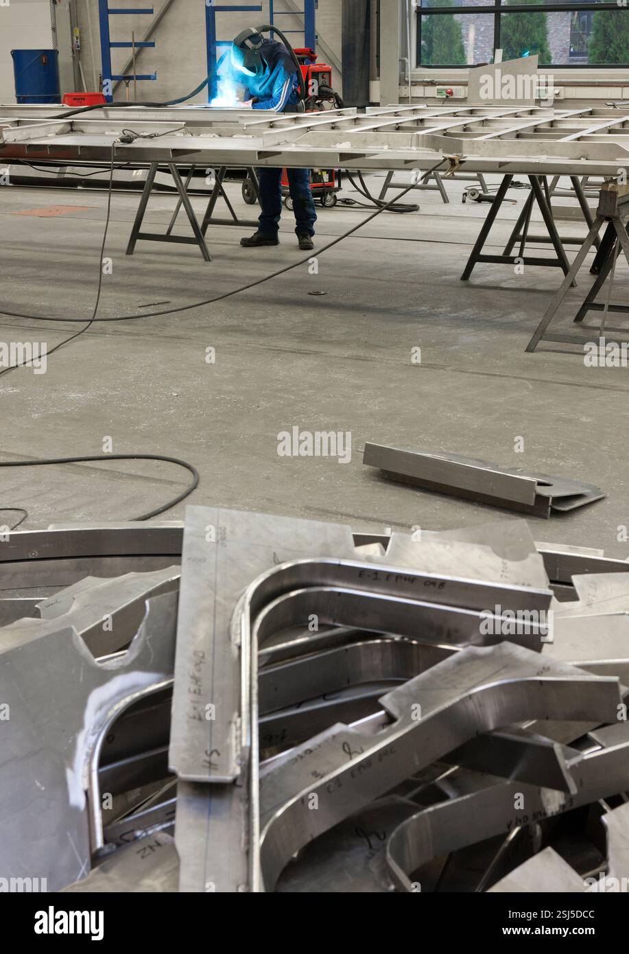 Welder at work welding aluminium. Shipbuilding Industry. Aluminium hull ...