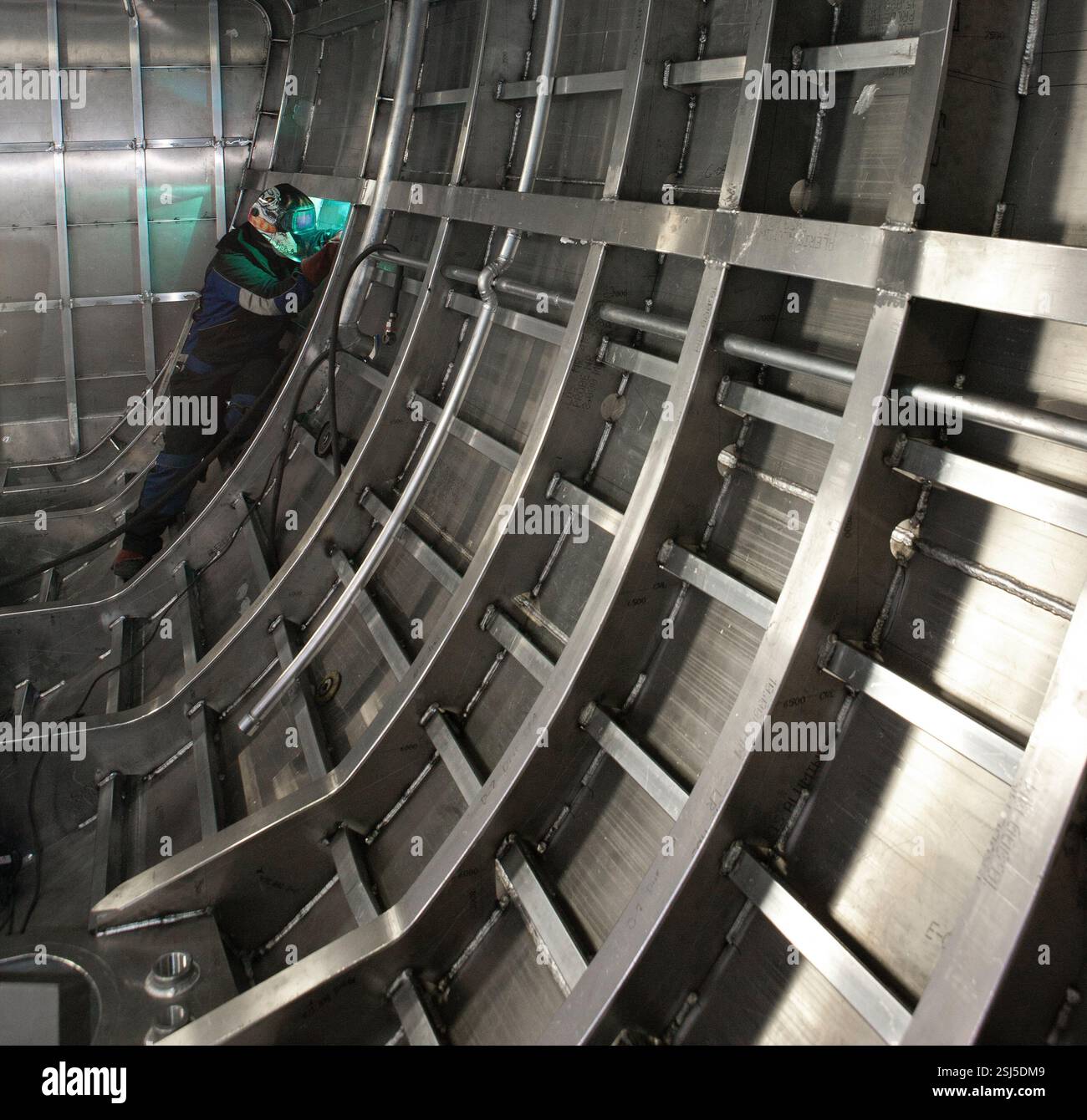 Welder at work welding aluminium. Shipbuilding Industry. Aluminium hull ...