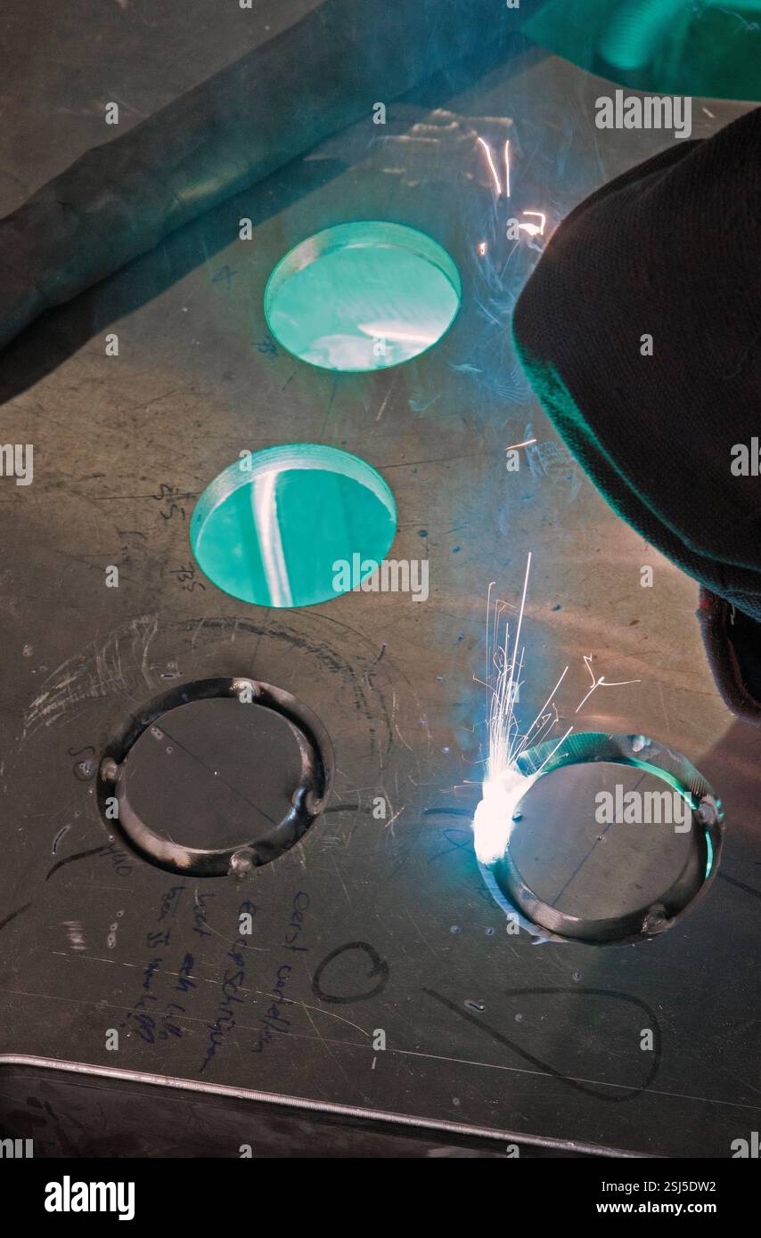 Welder at work welding aluminium. Shipbuilding Industry. Aluminium hull ...