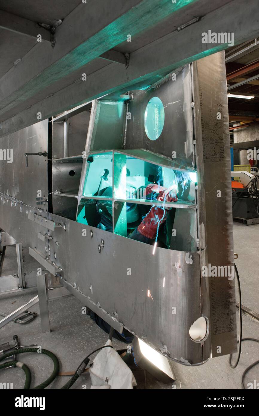 Welder at work welding aluminium. Shipbuilding Industry. Aluminium hull ...