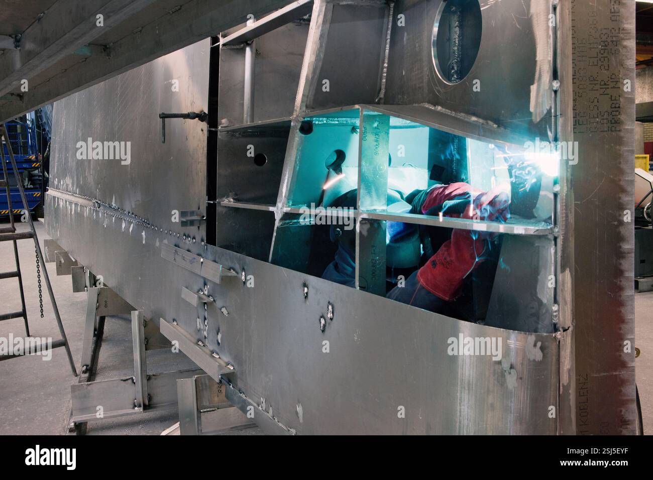 Welder at work welding aluminium. Shipbuilding Industry. Aluminium hull ...
