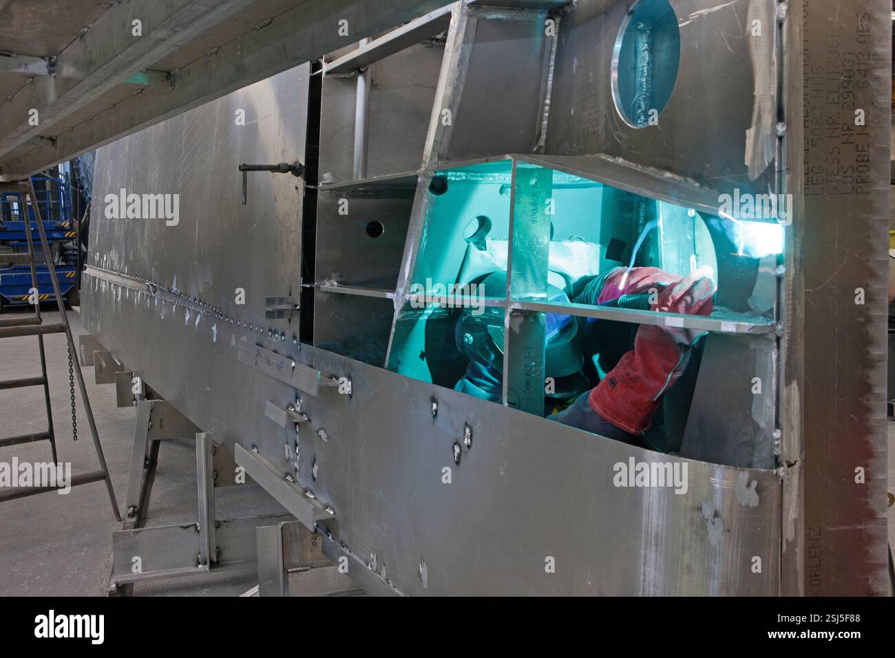 Welder at work welding aluminium. Shipbuilding Industry. Aluminium hull ...