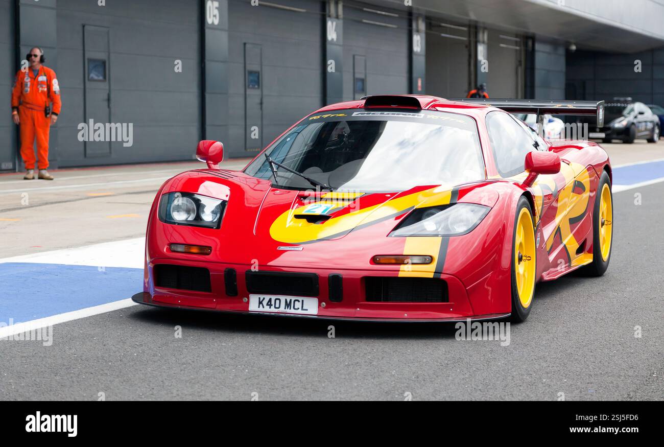 A 1995, Red and Yellow, McLaren F1 GTR, returning from the 90's ...