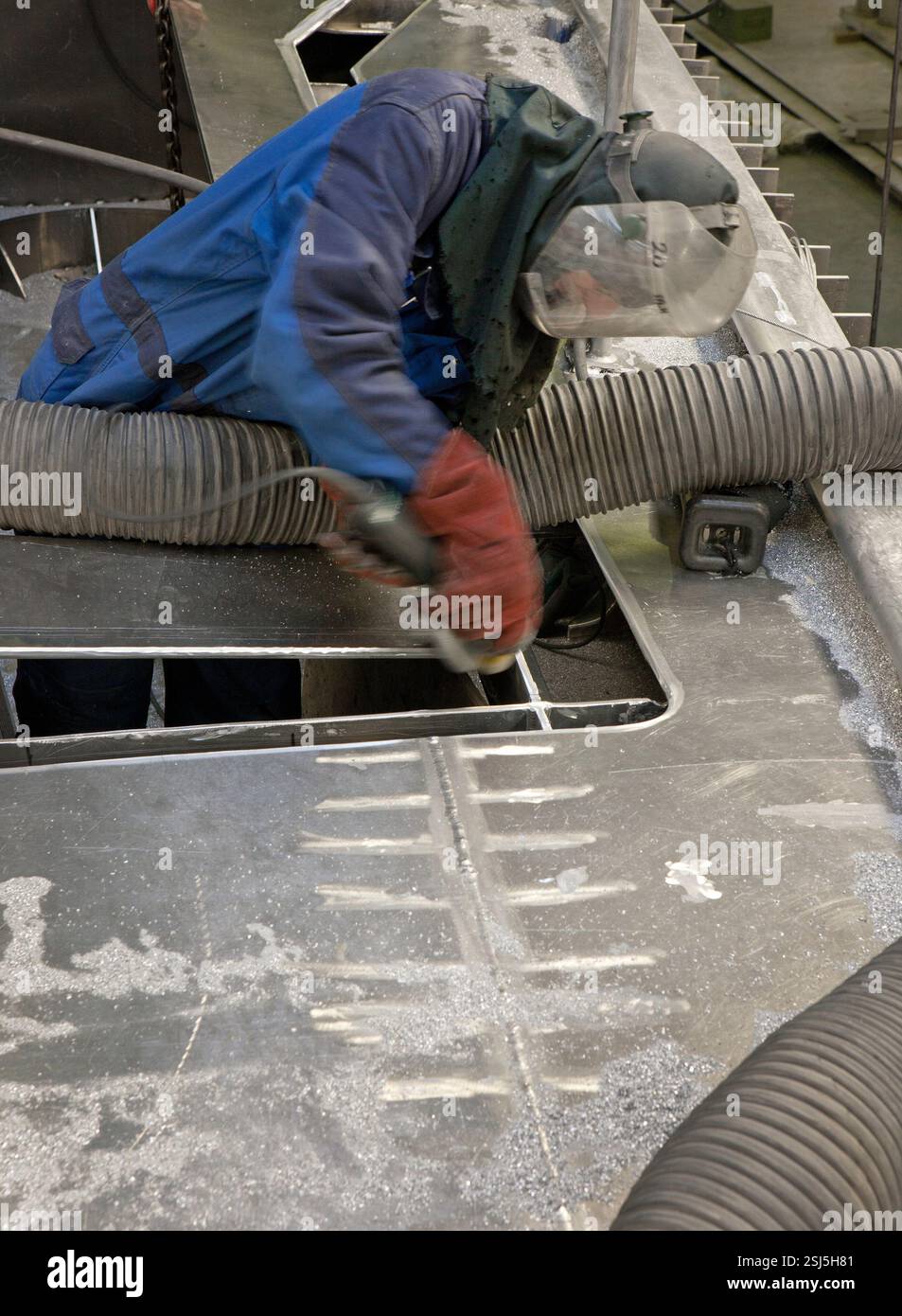 Welder at work welding aluminium. Shipbuilding Industry. Aluminium hull ...