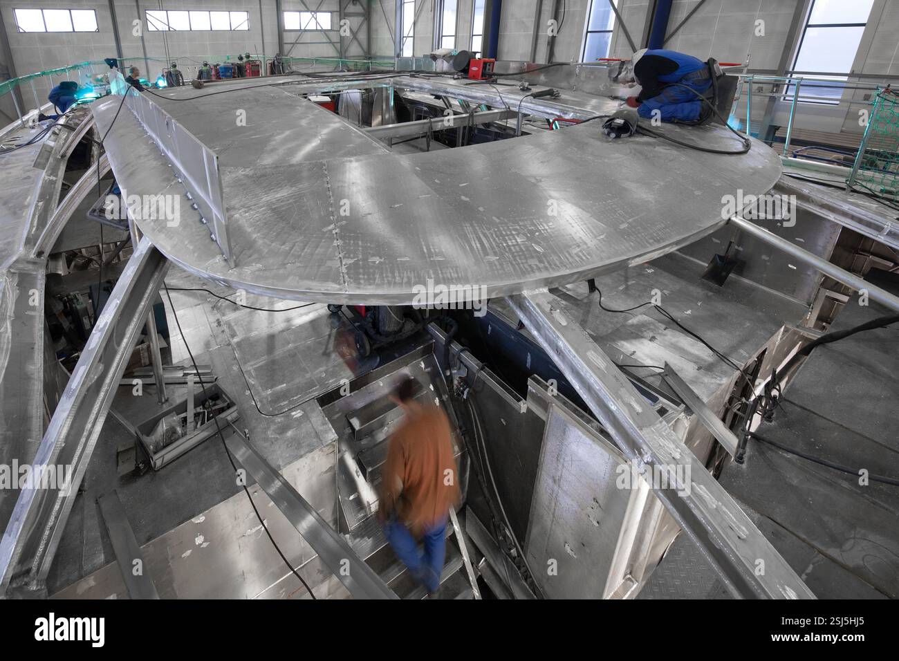 Welder at work welding aluminium. Shipbuilding Industry. Aluminium hull ...