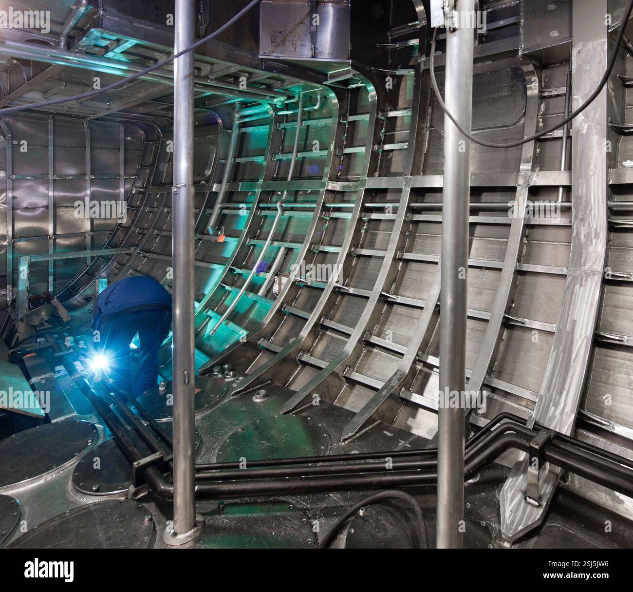 Welder at work welding aluminium. Shipbuilding Industry. Aluminium hull ...