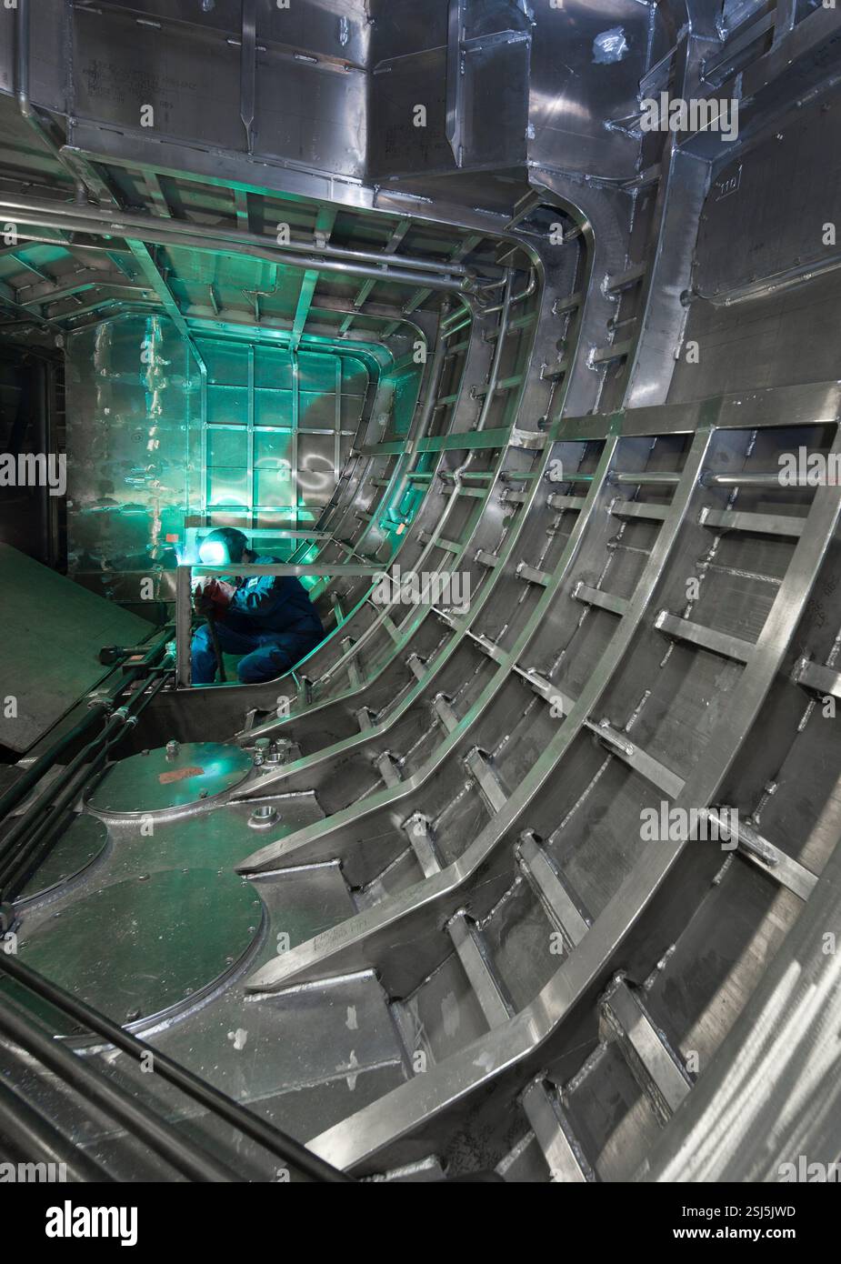 Welder at work welding aluminium. Shipbuilding Industry. Aluminium hull ...