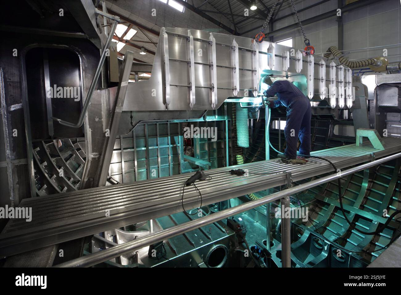 Welder at work welding aluminium. Shipbuilding Industry. Aluminium hull ...