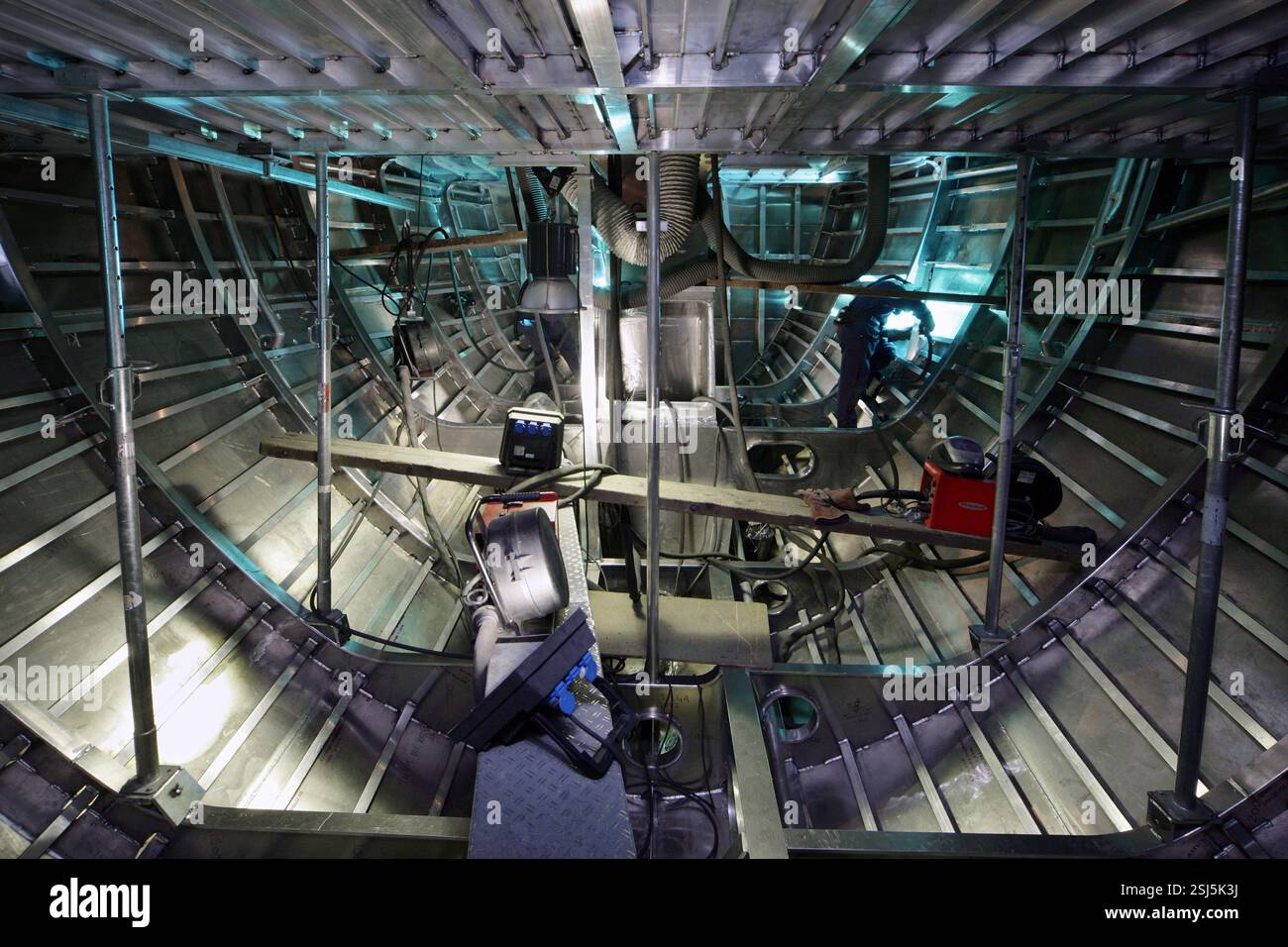 Welder at work welding aluminium. Shipbuilding Industry. Aluminium hull ...
