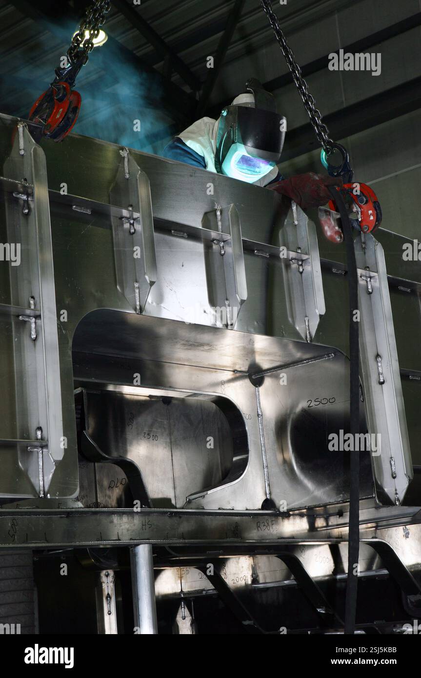 Welder at work welding aluminium. Shipbuilding Industry. Aluminium hull ...