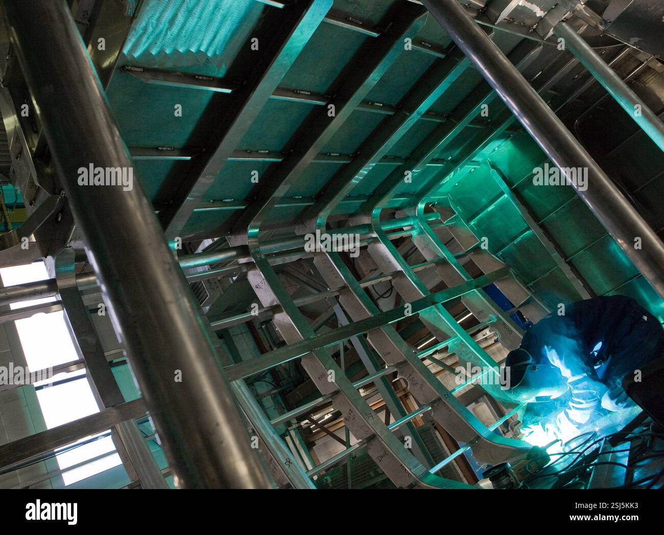 Welder at work welding aluminium. Shipbuilding Industry. Aluminium hull ...