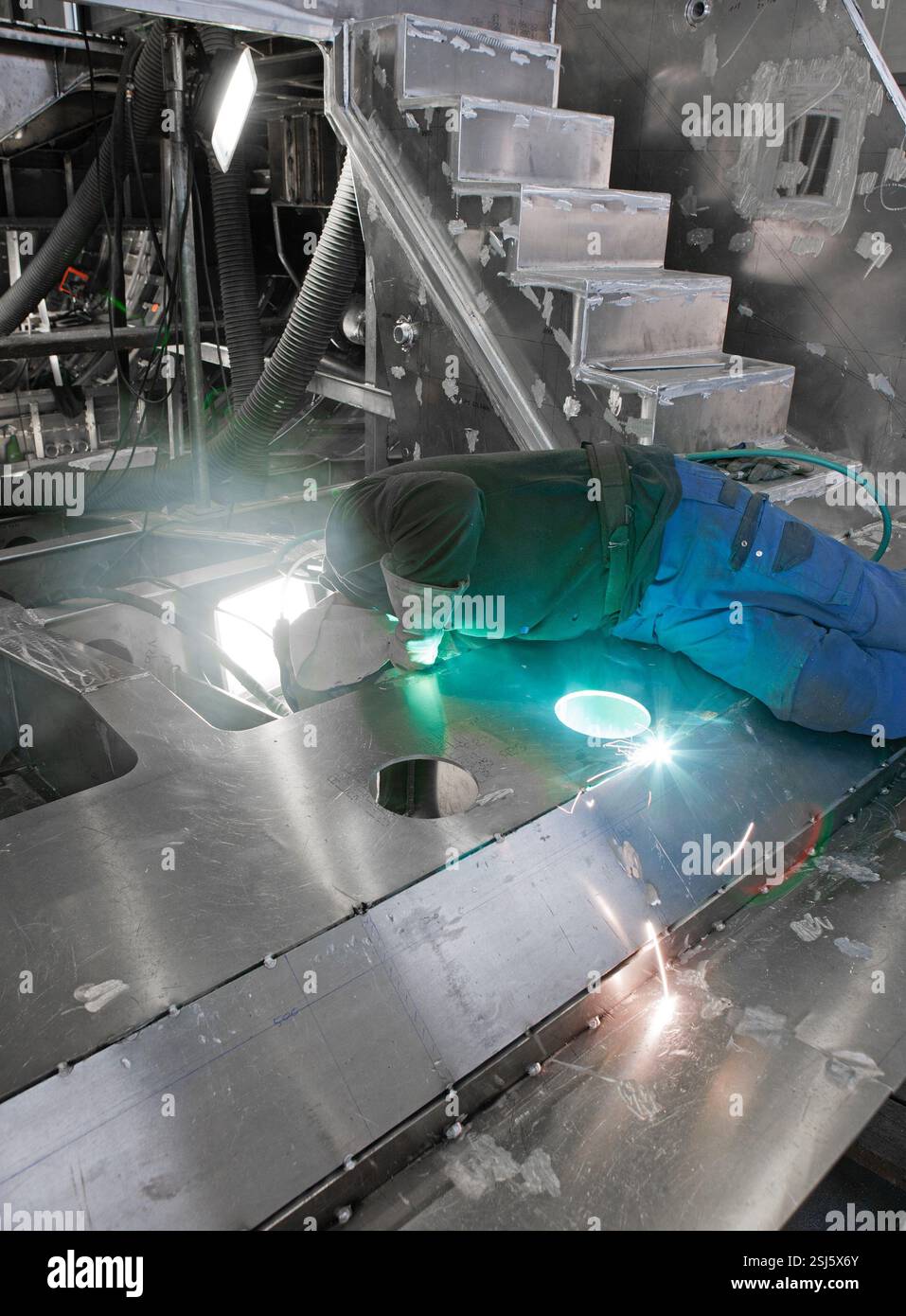 Welder at work welding aluminium. Shipbuilding Industry. Aluminium hull ...