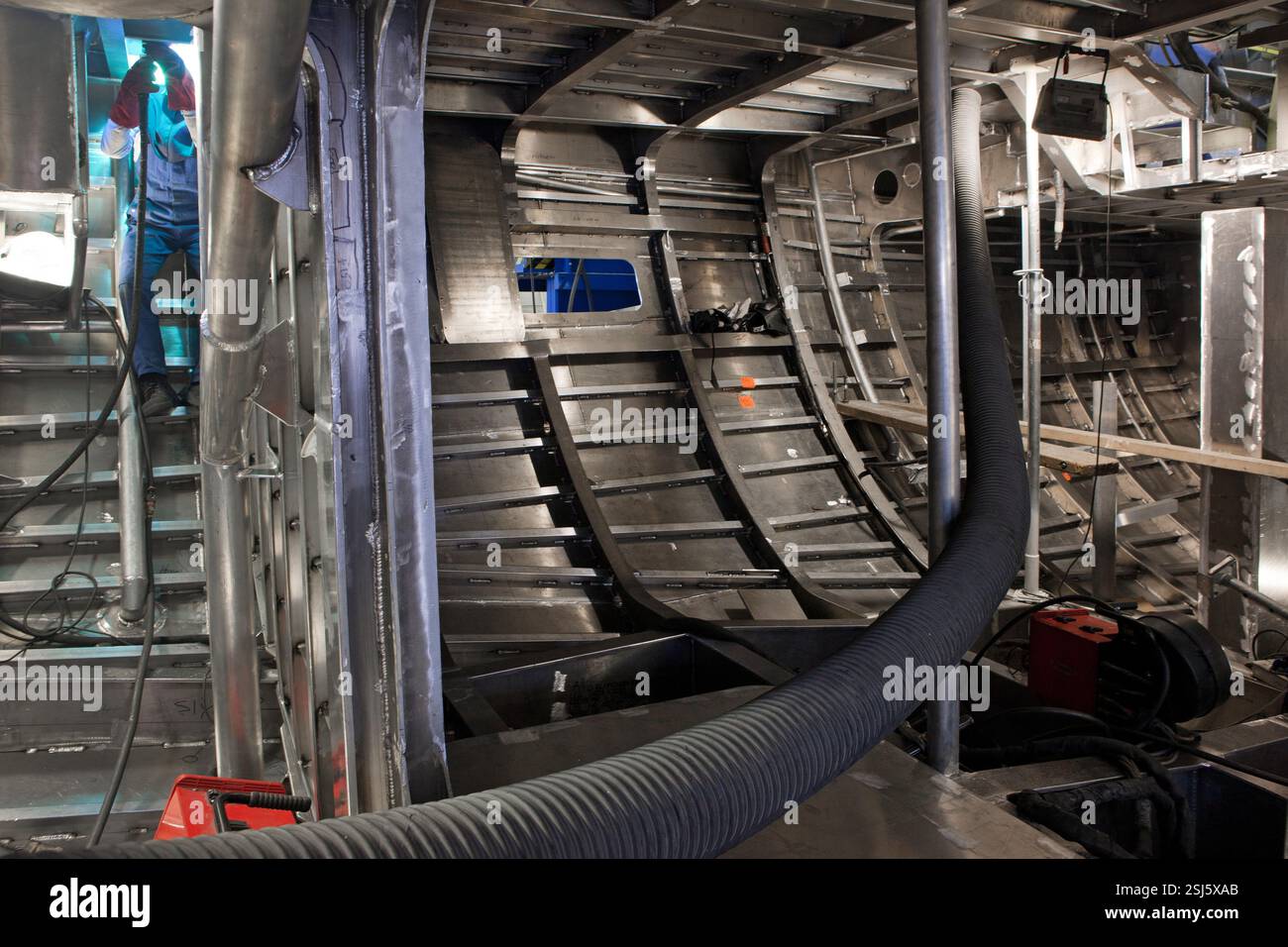 Welder at work welding aluminium. Shipbuilding Industry. Aluminium hull ...