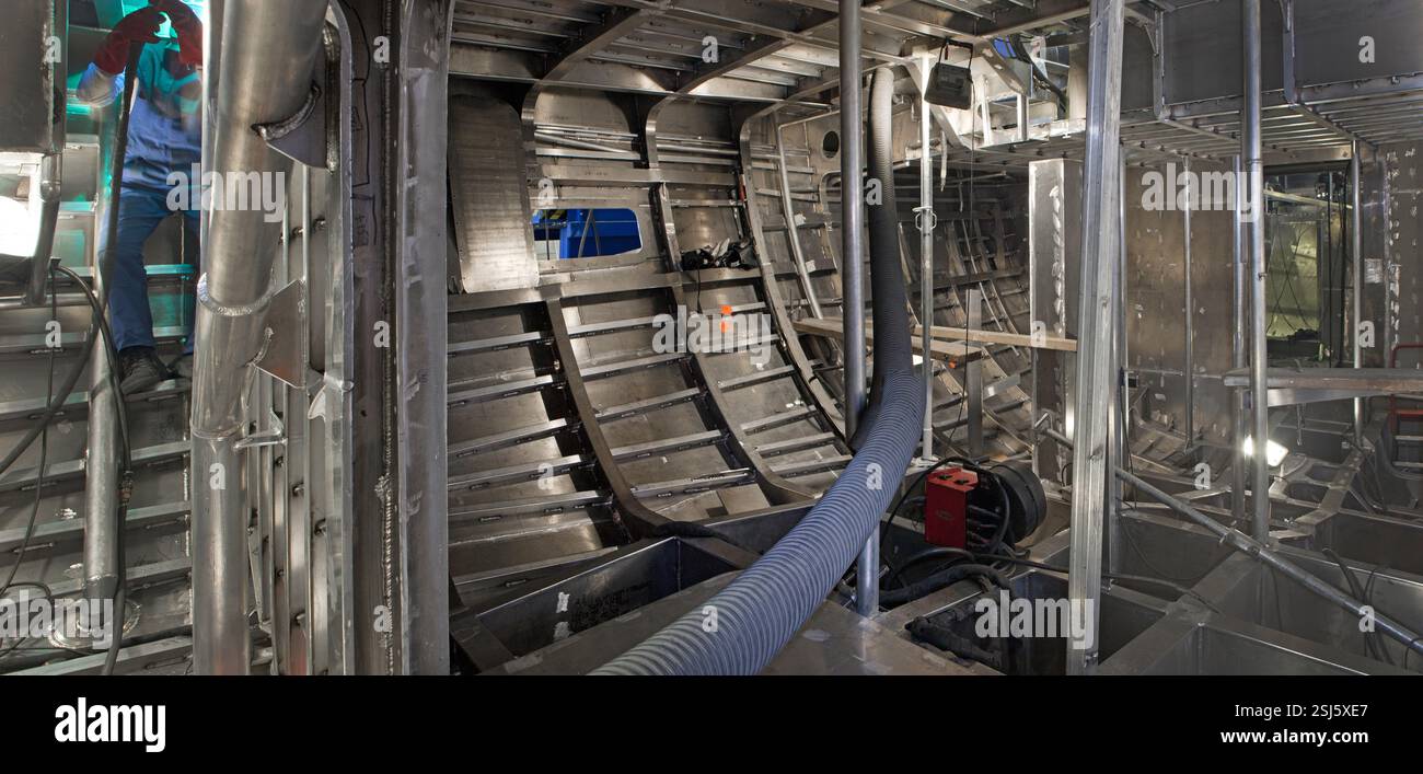 Welder at work welding aluminium. Shipbuilding Industry. Aluminium hull ...