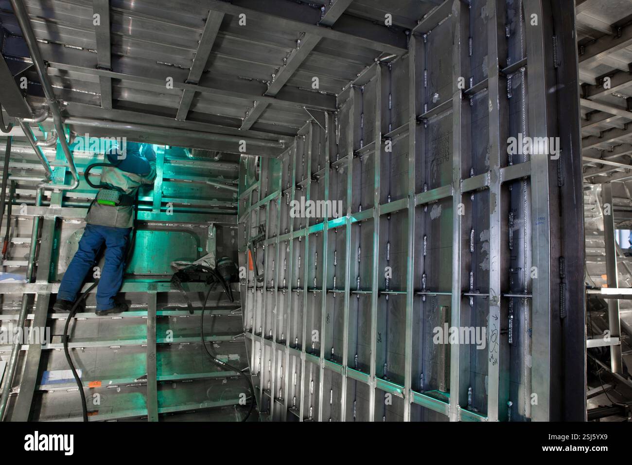 Welder at work welding aluminium. Shipbuilding Industry. Aluminium hull ...
