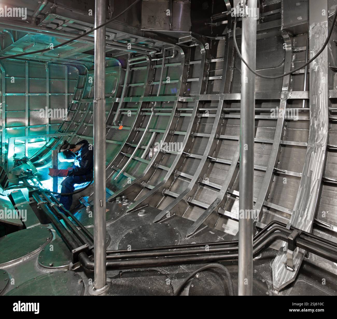 Welder at work welding aluminium. Shipbuilding Industry. Aluminium hull ...