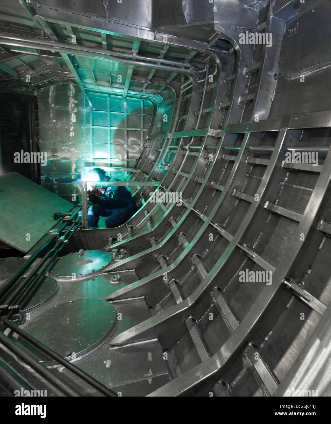 Welder at work welding aluminium. Shipbuilding Industry. Aluminium hull ...