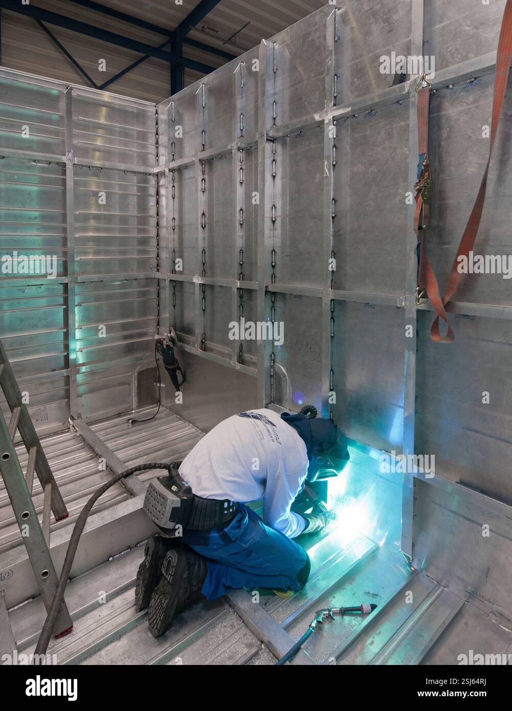 Welder at work welding aluminium. Shipbuilding Industry. Aluminium hull ...