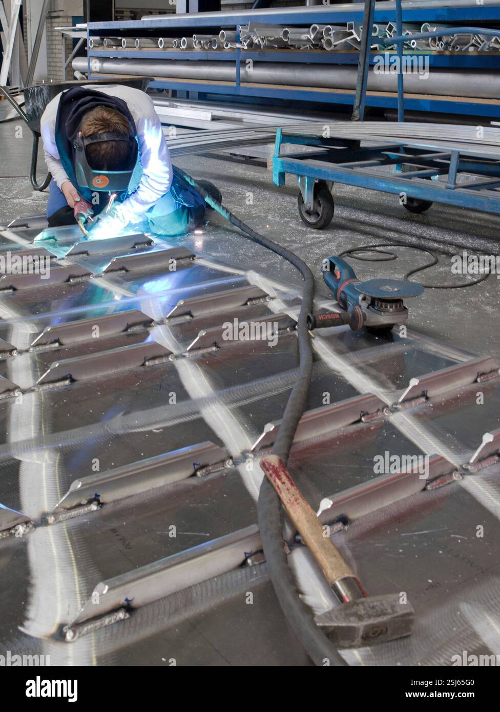 Welder at work welding aluminium. Shipbuilding Industry. Aluminium hull ...