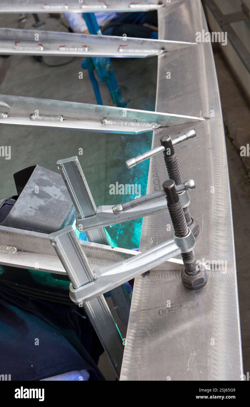Welder at work welding aluminium. Shipbuilding Industry. Aluminium hull ...