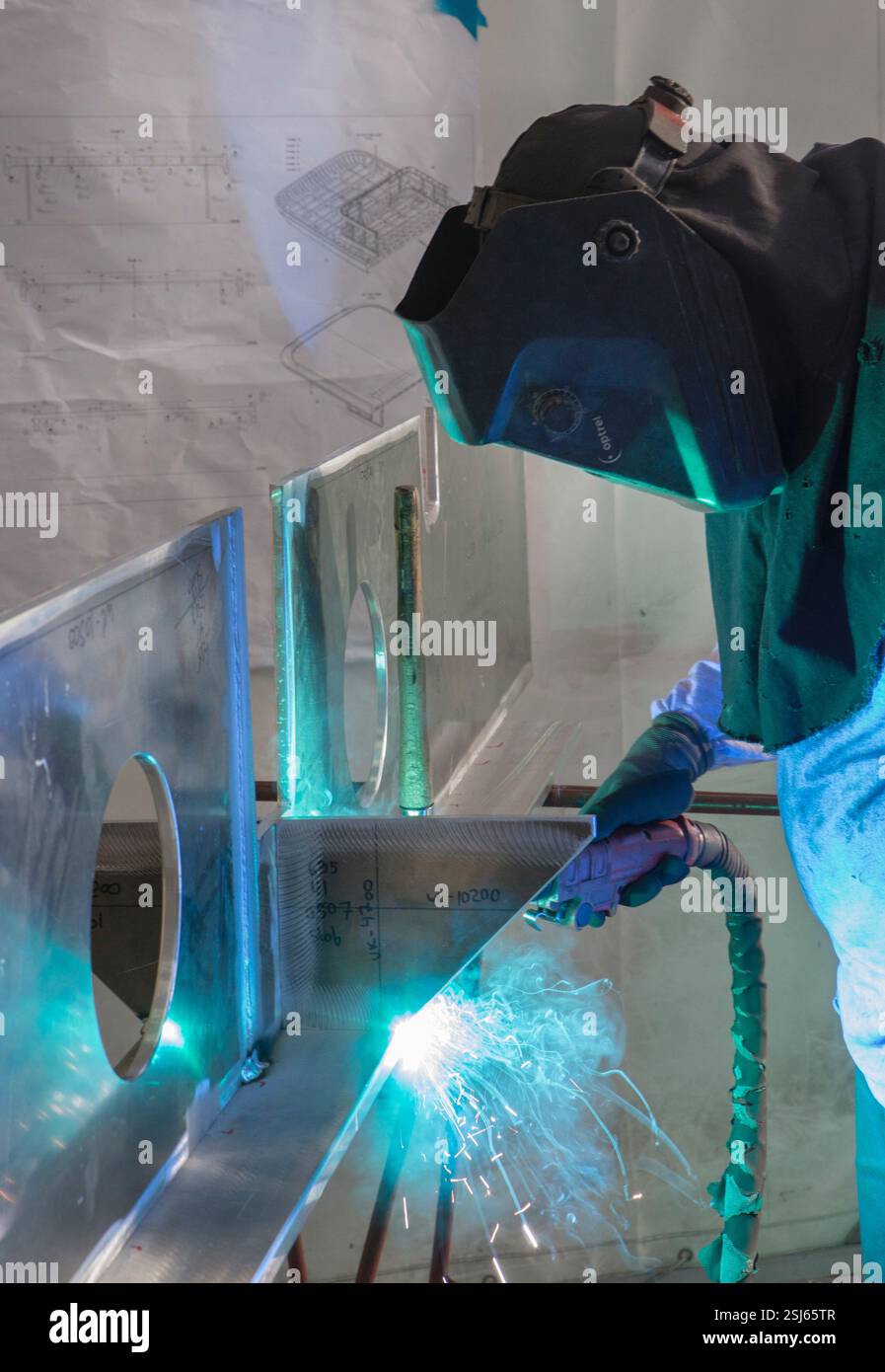 Welder at work welding aluminium. Shipbuilding Industry. Aluminium hull ...