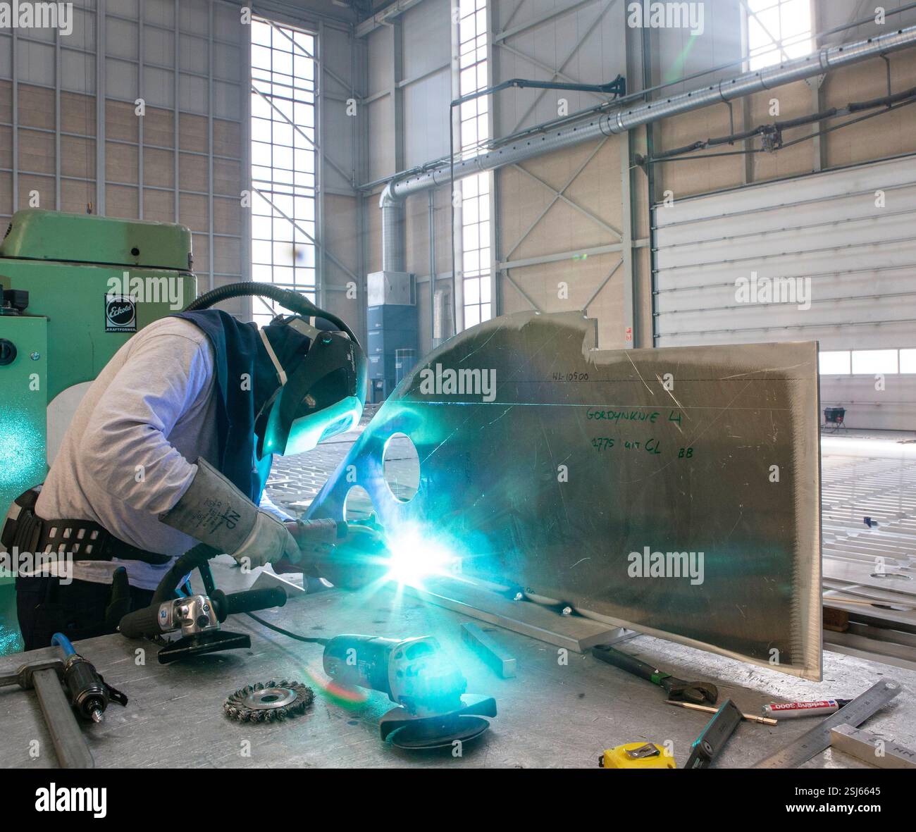 Welder at work welding aluminium. Shipbuilding Industry. Aluminium hull ...