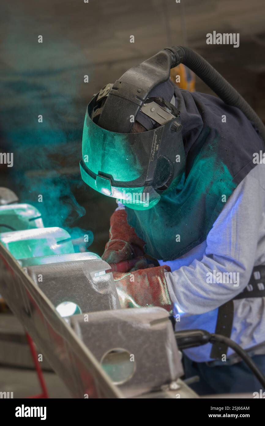 Welder at work welding aluminium. Shipbuilding Industry. Aluminium hull ...