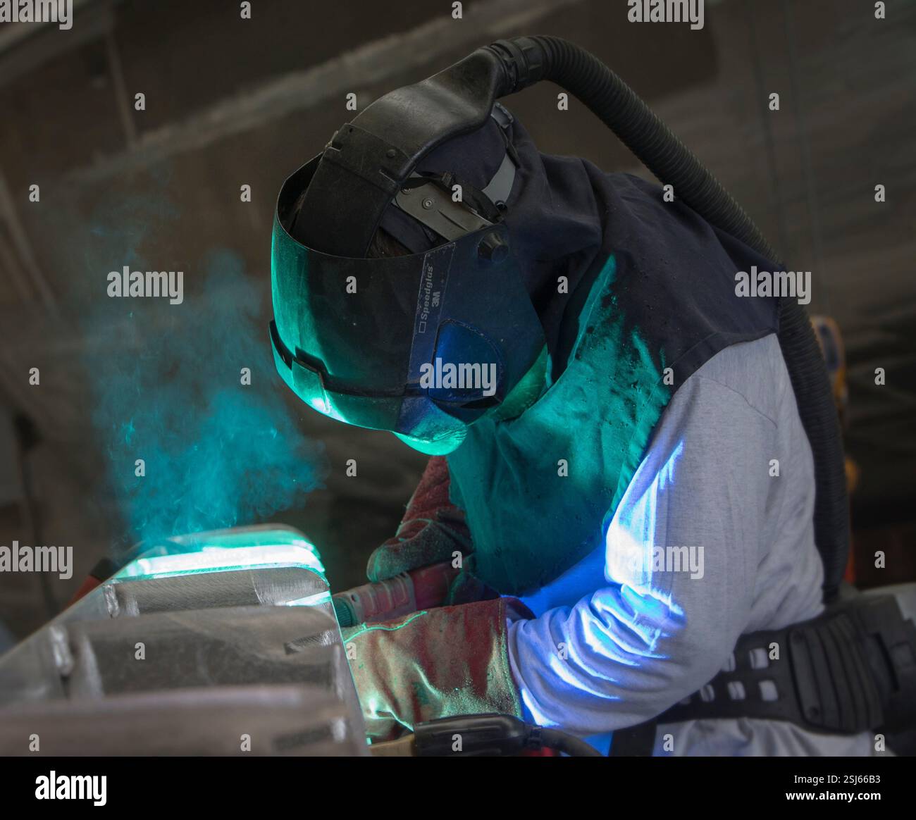 Welder at work welding aluminium. Shipbuilding Industry. Aluminium hull ...