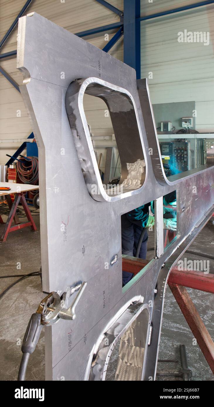Welder at work welding aluminium. Shipbuilding Industry. Aluminium hull ...