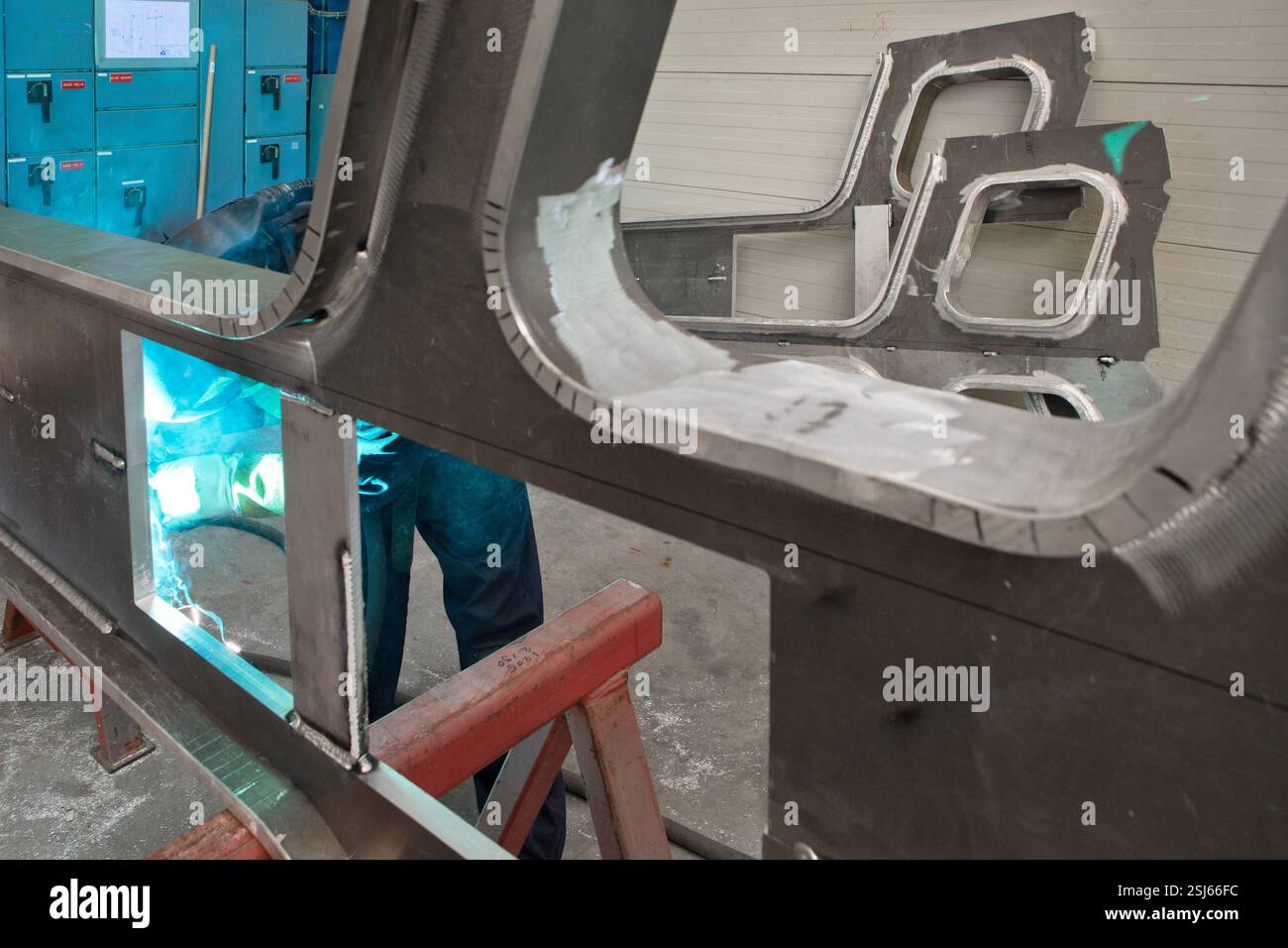 Welder at work welding aluminium. Shipbuilding Industry. Aluminium hull ...