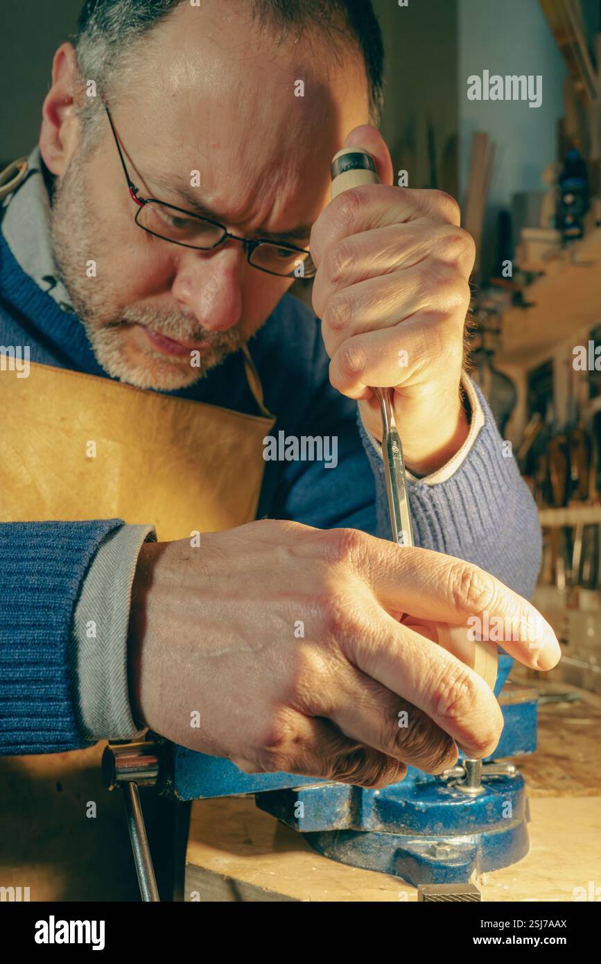 Cremona, Italy - February 6th 2025 Master Luca Tenore Italian luthier ...