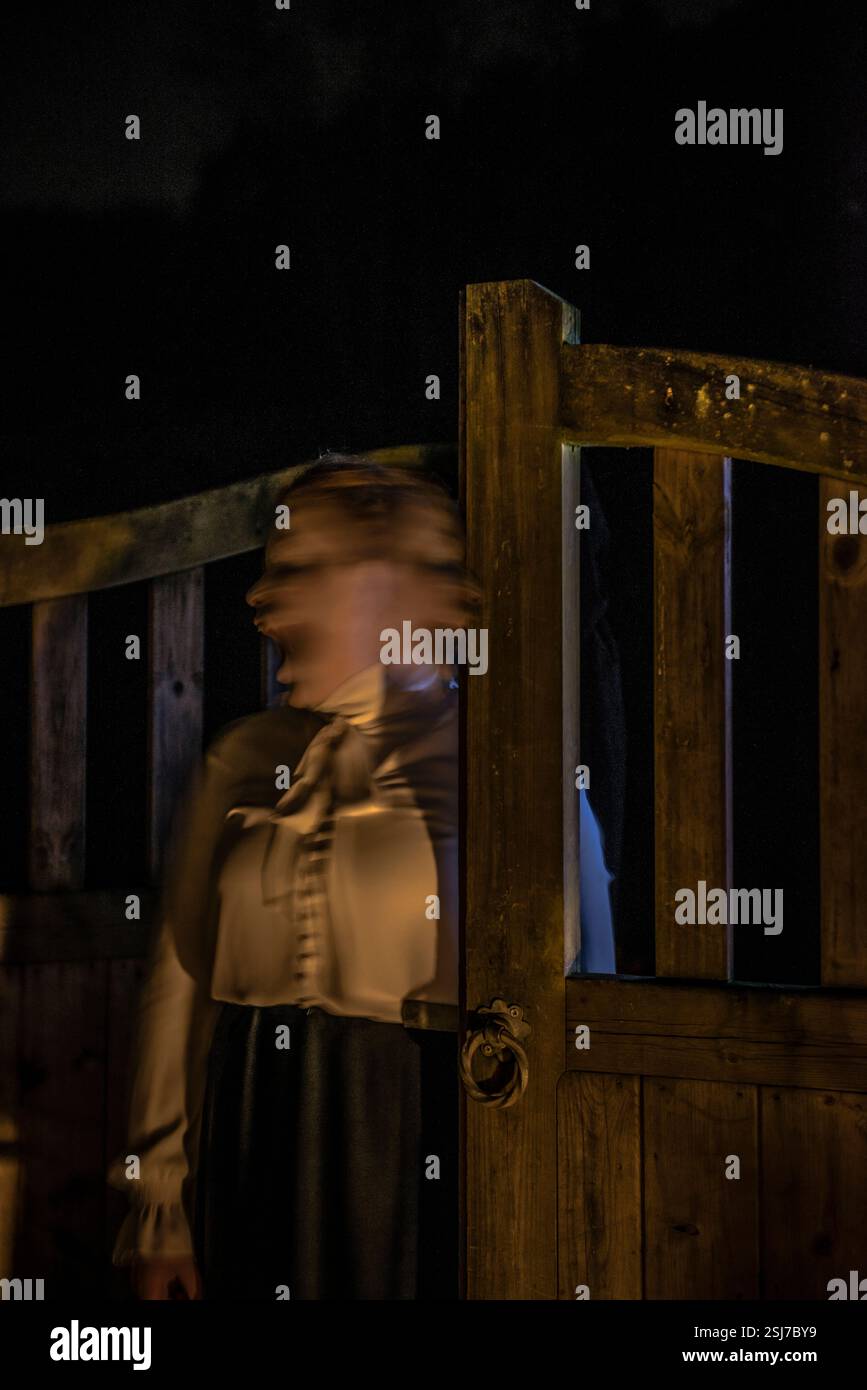 Ghost walking through gates Stock Photo - Alamy