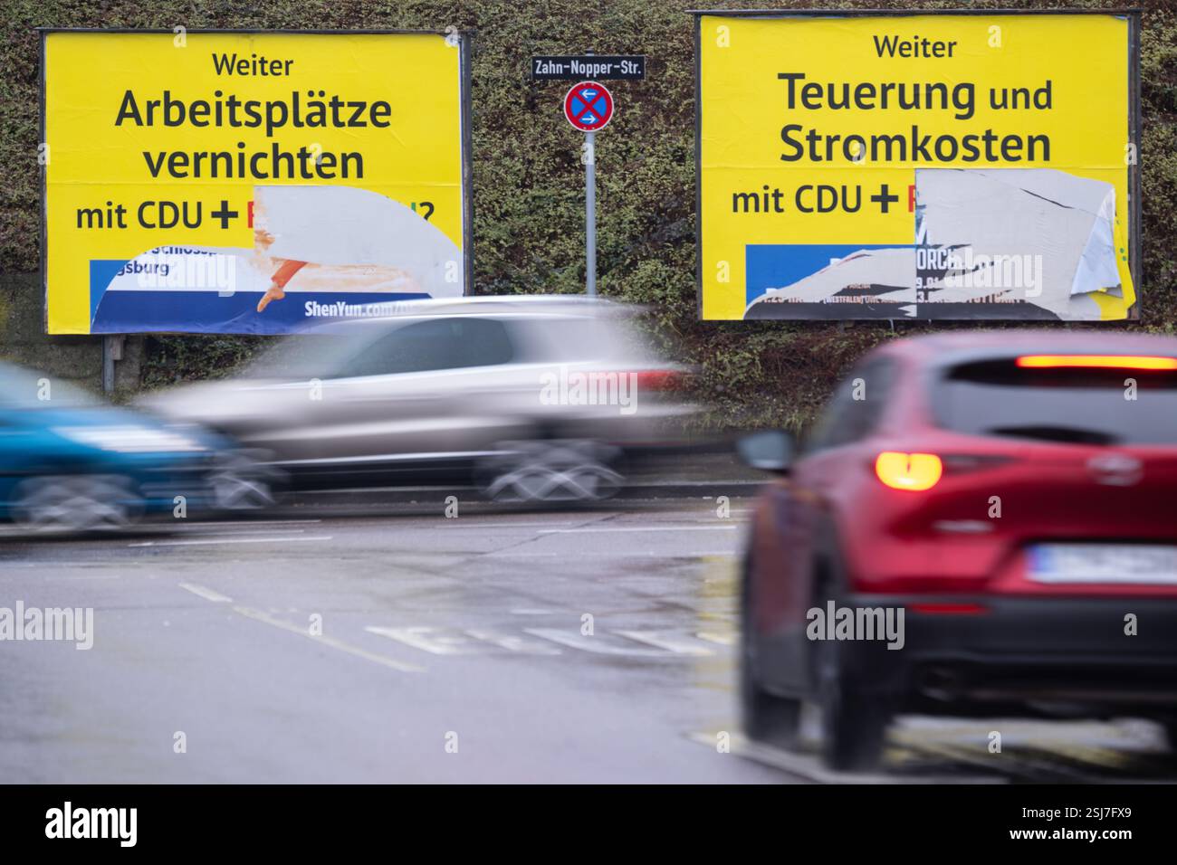 Stuttgart, Germany. 11th Feb, 2025. Cars drive past two destroyed ...